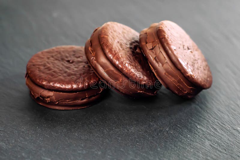 Cookies in Chocolate Glaze on the Table in Bulk. Side View Stock Image ...