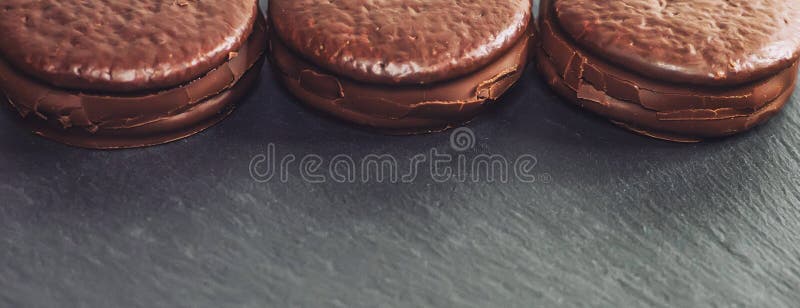 Cookies in Chocolate Glaze on the Table in Bulk. Top View Stock Photo ...