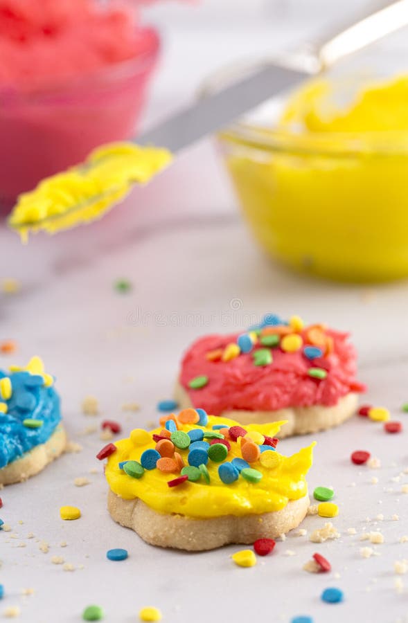 Cookies Decorated with Primary Colored Frosting with Rainbow Sprinkles ...