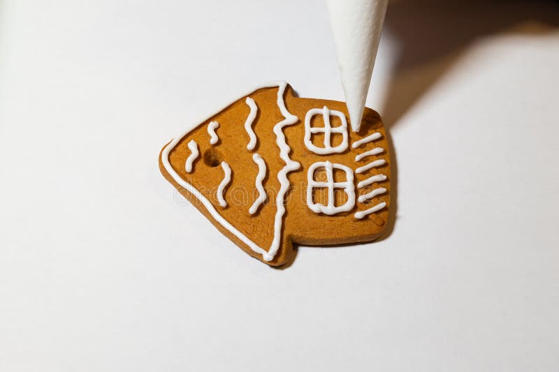 The Cookies are Decorated and Covered with Liquid White Sugar Icing ...