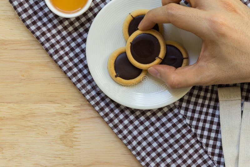 Hand Picking Cookie stock image. Image of biscuit, plate - 56124743