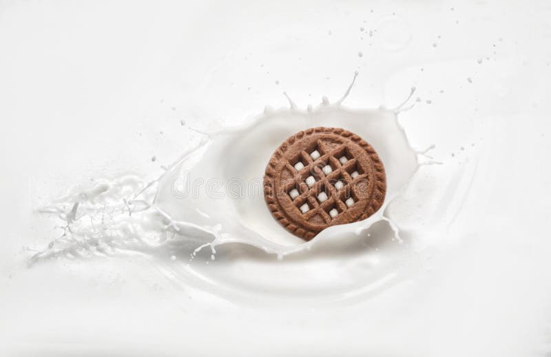Cookies in Milk with a Splash Stock Photo - Image of food, cookie ...
