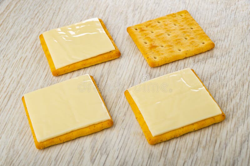 Cookies with Slices of Melted Cheese, Cracker on Table Stock Photo ...