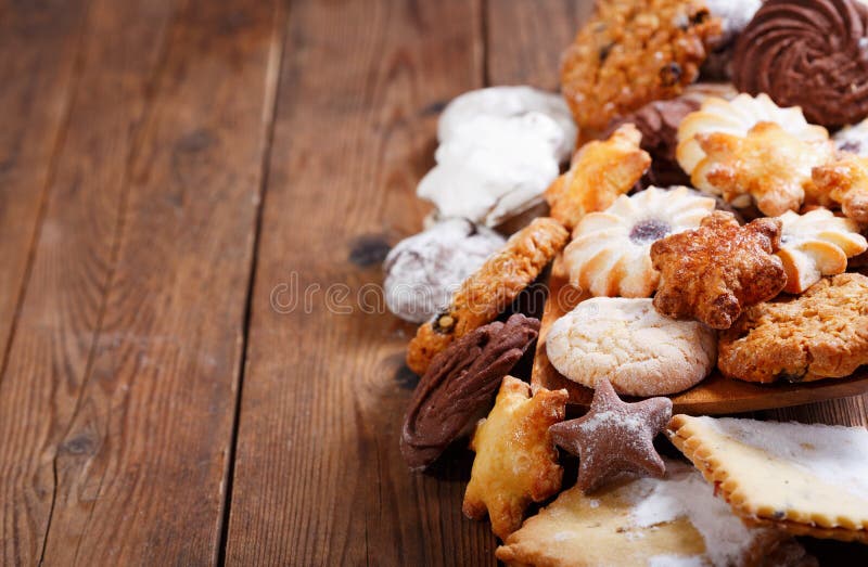 Cookies on wooden table stock photo. Image of collection - 138440704