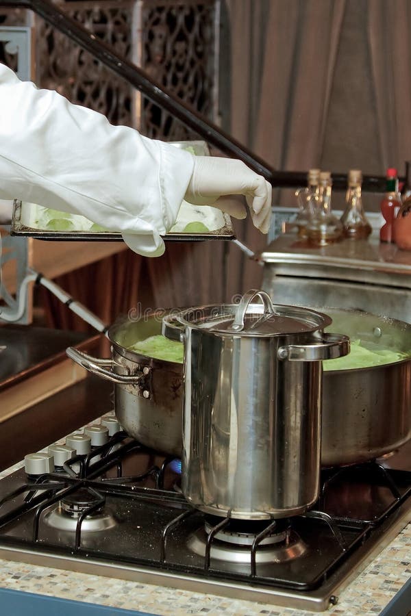 Chef S Hands on the Background of a Pot on the Stove Stock Photo ...
