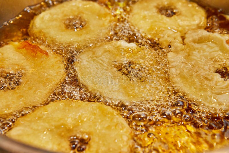 Cooking Apple Pancake. Apple Donut in Boiling Oil Stock Image - Image ...