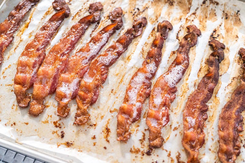 Cooking bacon strips stock image. Image of food, cooking - 276707055