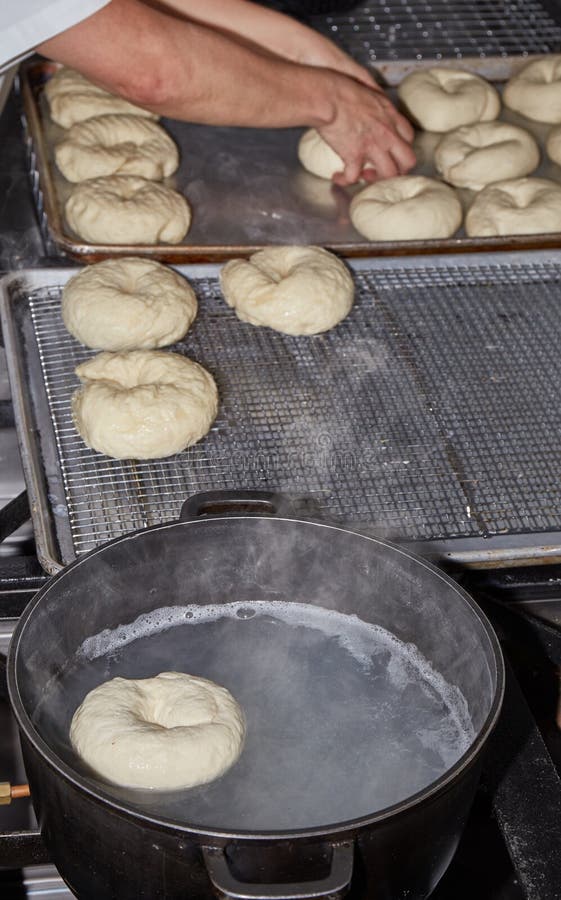 Cooking bagel in hot water stock image. Image of culinary - 118422217