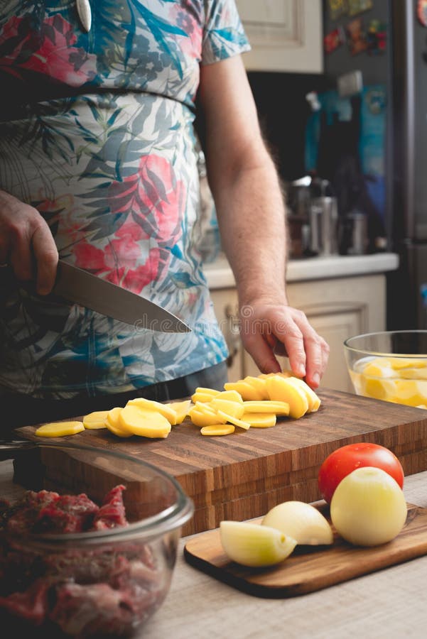 Cooking Baked Meat with Potatoes Vertical Stock Photo - Image of board ...