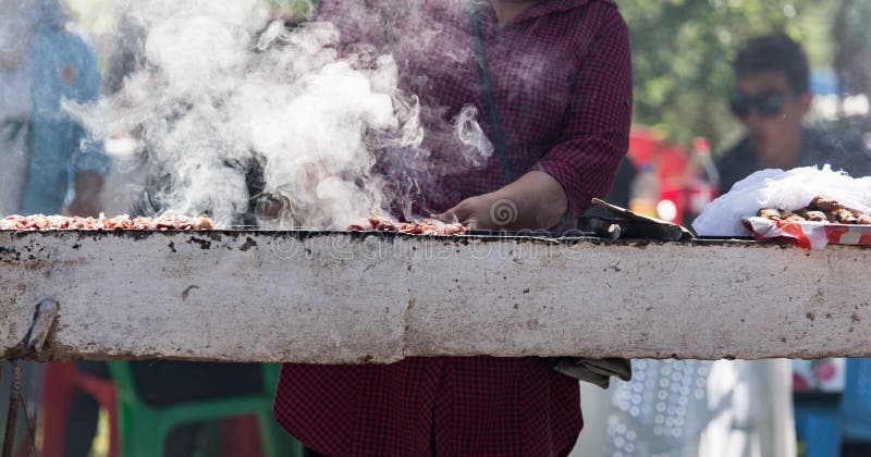 Cooking Barbecue on the Grill in the Open Air Stock Photo - Image of ...