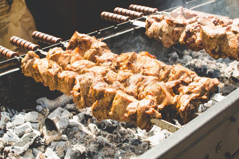 Cooking Barbecue. Pork Meat Roasted on a Spit Stock Photo - Image of ...