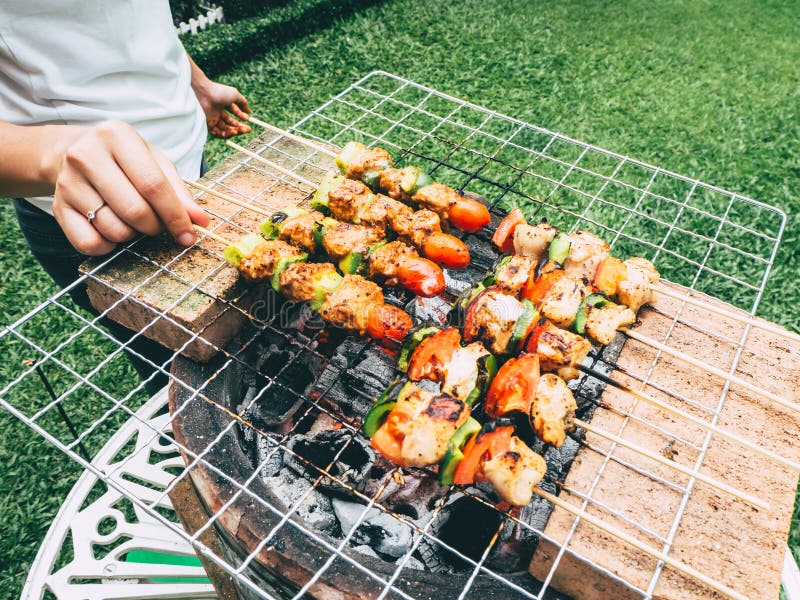 Cooking Barbeque in the Garden. Stock Photo - Image of family ...