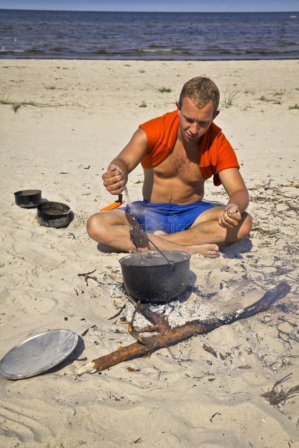 Cooking on the beach stock image. Image of activity, kettle - 67570543