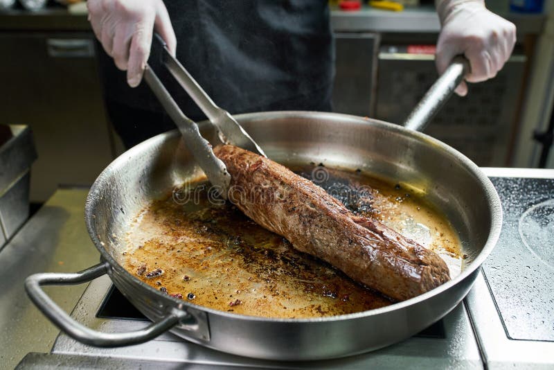 Cooking Beef in a Restaurant. Steak and Chef Stock Photo - Image of ...