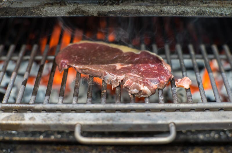 Cooking Beef Steak on a Barbecue Grill. Restaurant, Chef. Open Fire ...