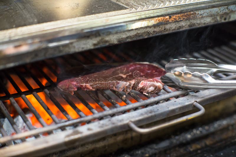 Cooking Beef Steak on a Barbecue Grill. Restaurant, Chef. Open Fire ...