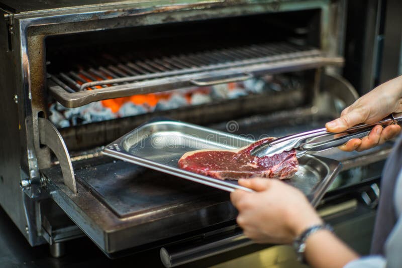 Cooking Beef Steak on a Barbecue Grill. Restaurant, Chef. Open Fire ...