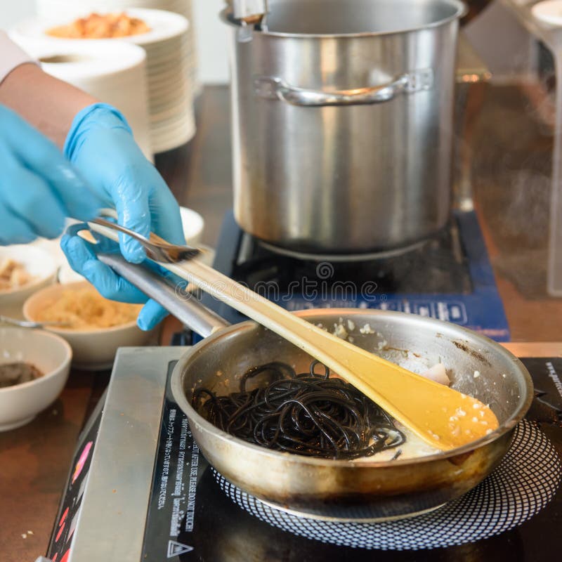 Cooking Black Spaghetti by Chef Stock Photo - Image of person, happy ...