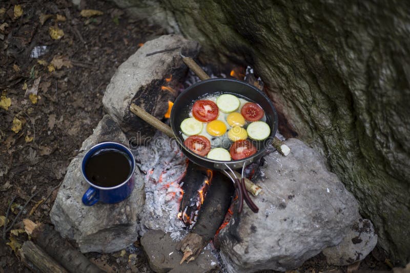 Cooking Breakfast on a Campfire at a Summer Camp. Stock Image - Image ...