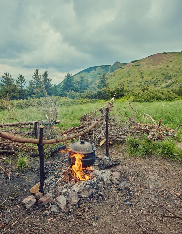 Cooking Breakfast on Fire in Mountains Stock Photo - Image of ...
