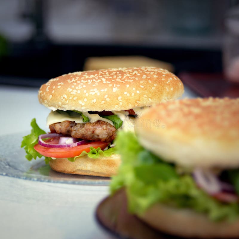 Big Hamburgers on the Plate Stock Photo - Image of white, lettuce ...