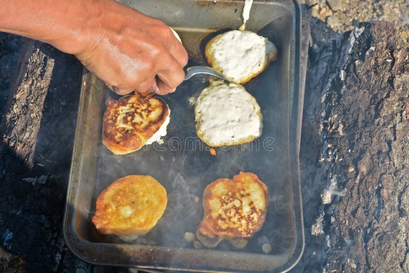 Cooking cakes on the fire. stock photo. Image of bonfire - 82151418