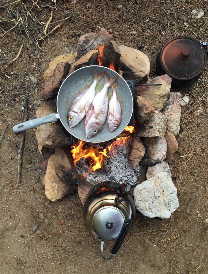 Cooking at camp stock image. Image of kettle, camping - 55941283