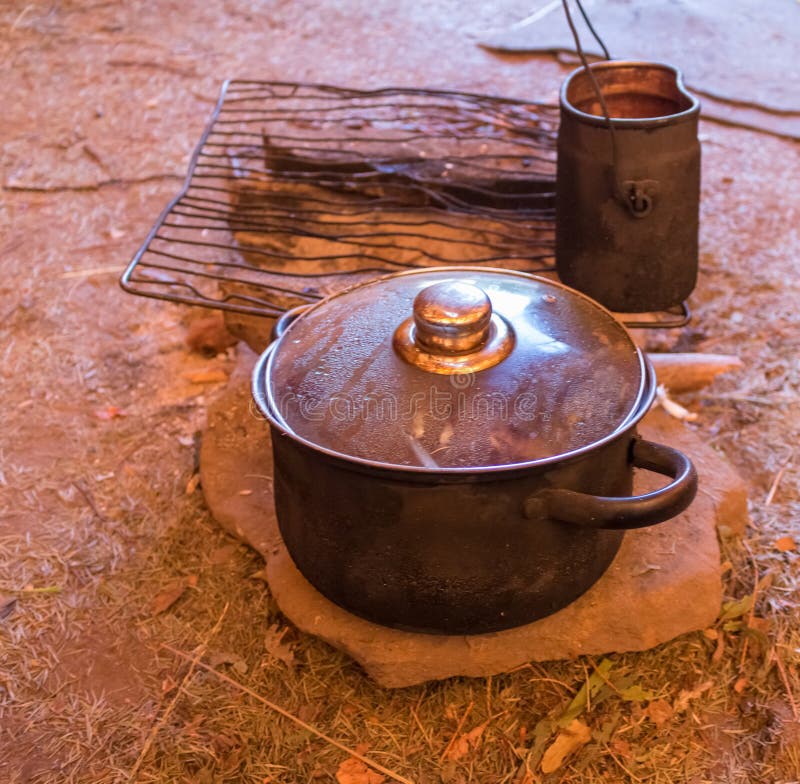 Cooking on a campfire stock image. Image of cook, burning - 280867921