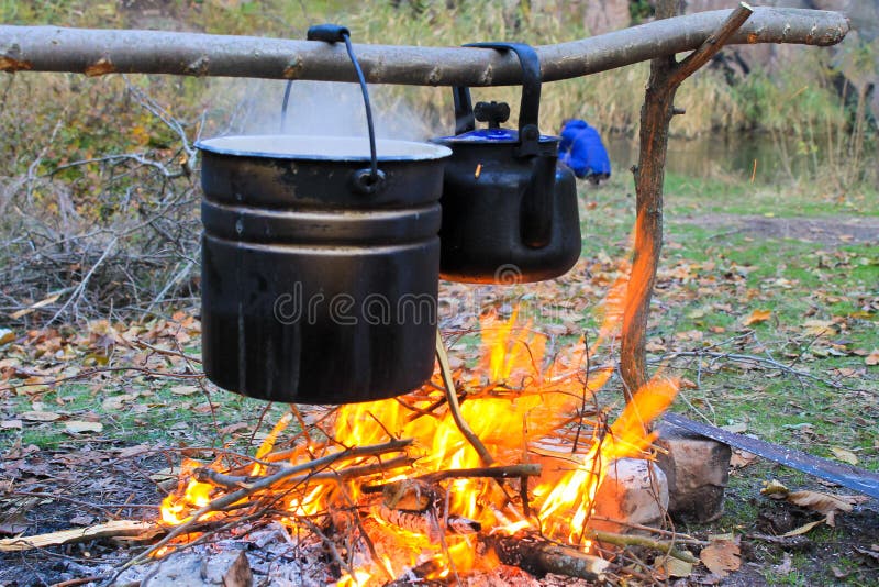Cooking on Campfire in Camping Stock Photo - Image of cook, flame ...