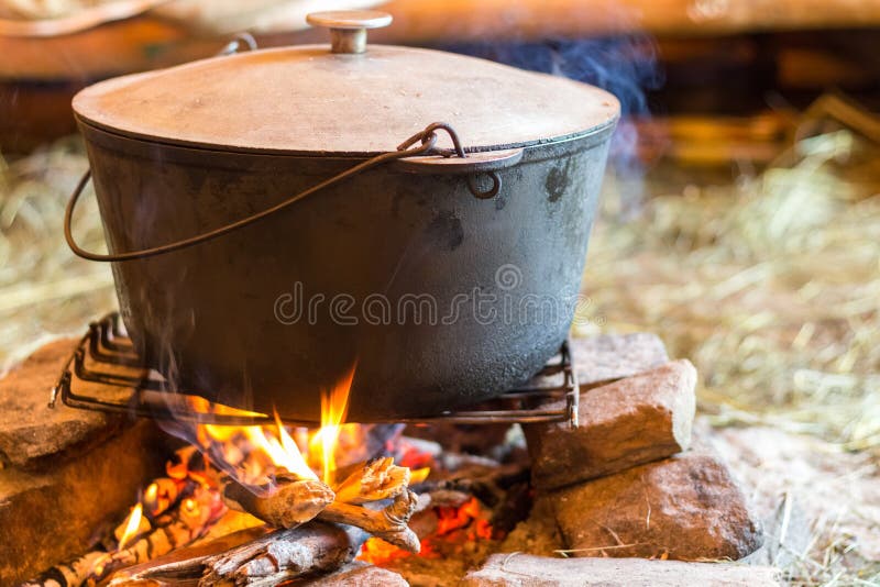 Cooking in a Cauldron on Fire Stock Photo - Image of iron, outdoor ...