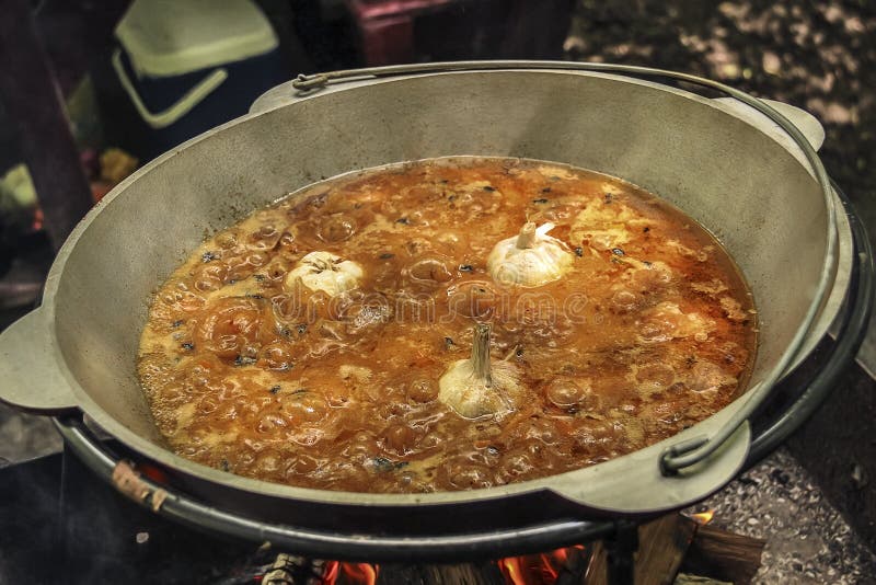 Cooking in a cauldron stock photo. Image of fresh, delicious - 71881798