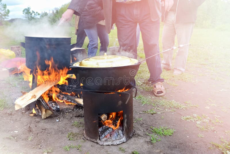 Cooking in a Cauldron Over an Open Fire. Outdoor Recreation Concept ...