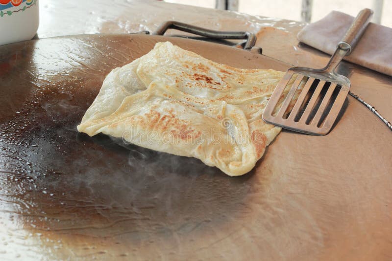 Cooking chapati on the pan stock photo. Image of diet - 37997532