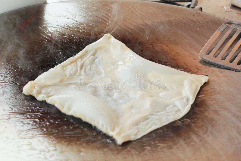 Cooking chapati on the pan stock photo. Image of french - 38179912