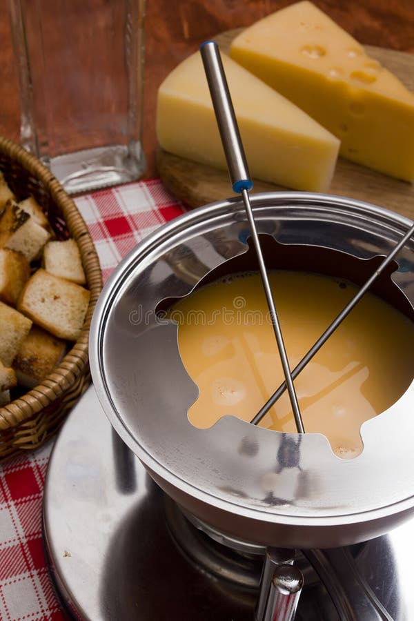 Cooking cheese fondue stock photo. Image of swiss, fondue - 72732828