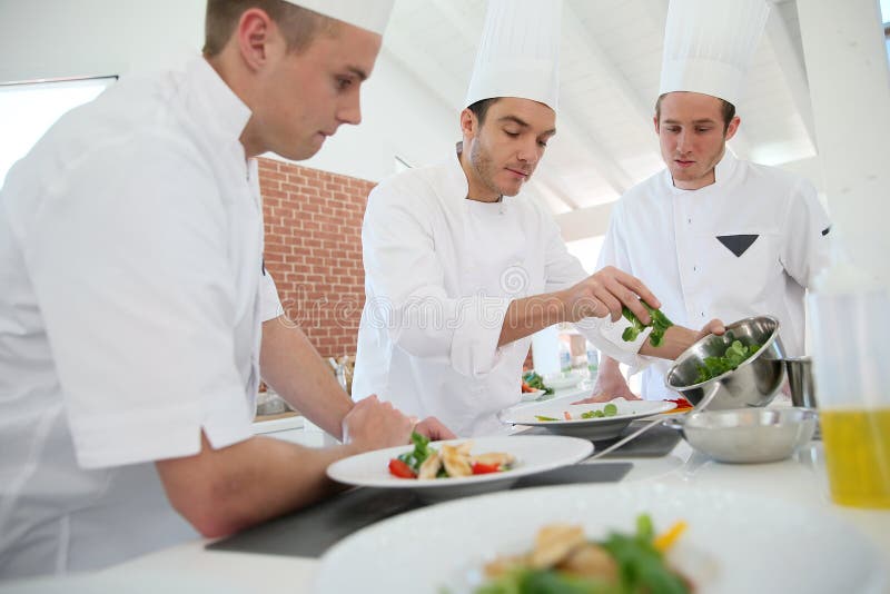 Cooking Chef and Staff in Restaurant Stock Photo - Image of teaching ...
