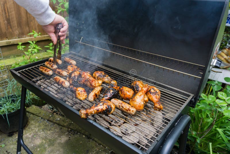 Cooking Chicken on a Barbecue. Stock Image - Image of produced, smoke ...