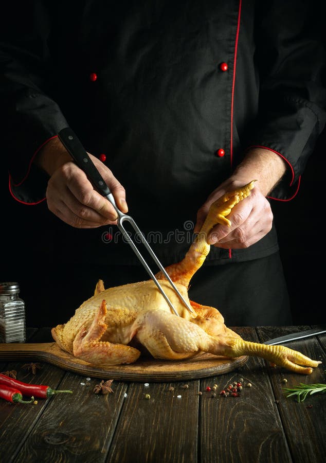 Cooking Chicken in the Restaurant Kitchen by the Cook. Raw Chicken on a ...