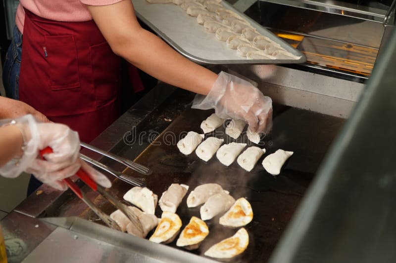 Cooking of Chinese Dumplings Stock Photo - Image of person, seafood ...