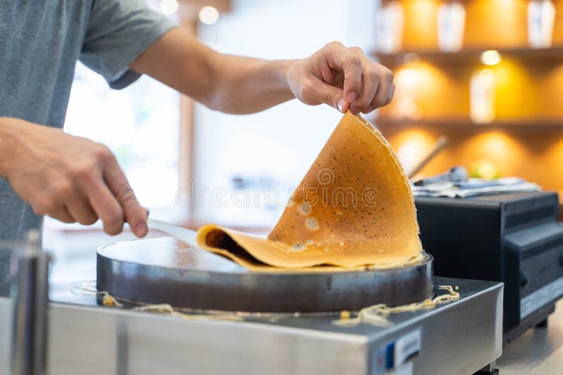 Cooking Chocolate Crepes with Crepe Maker Stock Image - Image of ...