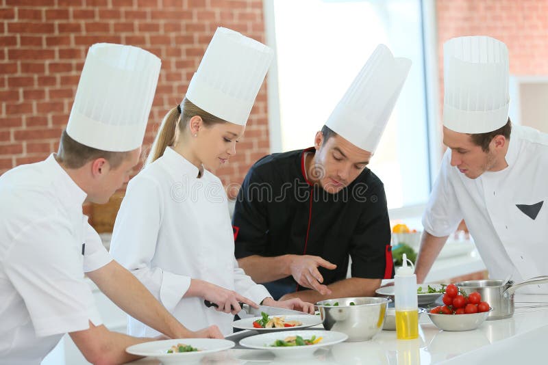 Cooking class with chef stock image. Image of recipe - 51285469