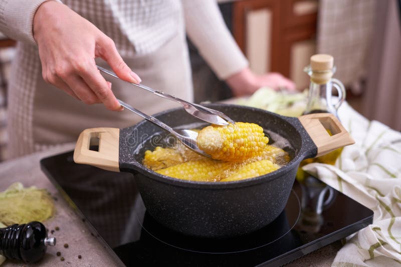 Cooking Corn Cob in a Pot of Boiling Water with Bubbles Stock Photo ...