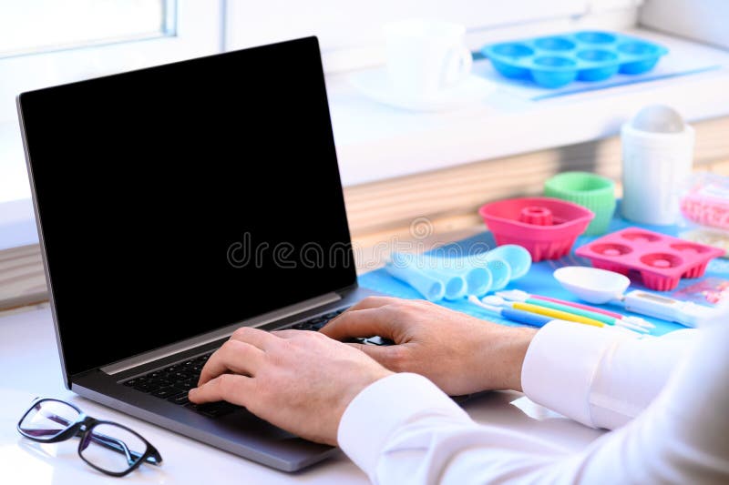 . Cooking Courses. on the Table There is a Laptop and Many Ingredients ...