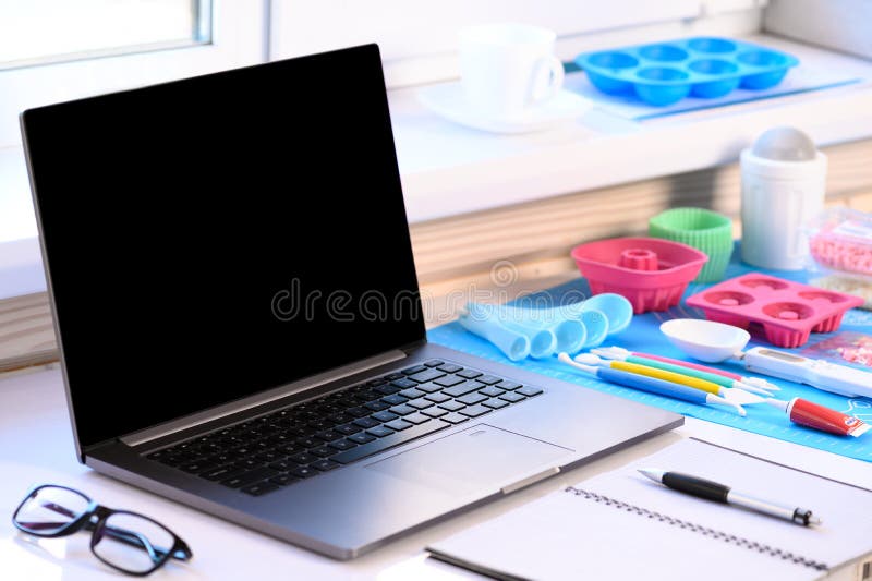 . Cooking Courses. on the Table There is a Laptop and Many Ingredients ...