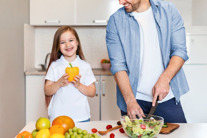 Father and Daughter Preparing Dinner Together in Kitchen at Home Stock Photo - Image of male ...