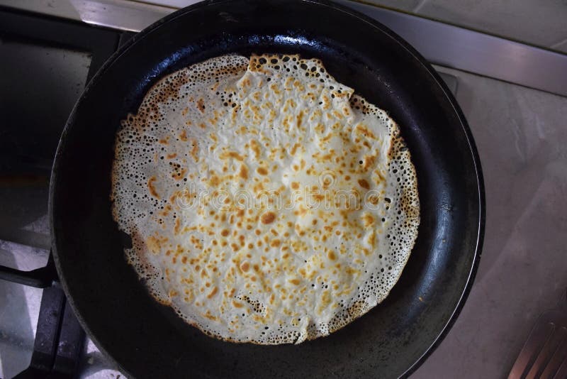 Cooking a Delicious Fried Pancake in a Pan. View from Above Stock Photo ...