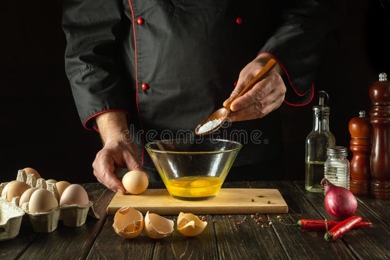 Cooking a Delicious Omelette for Breakfast from Eggs by the Chef Hands ...