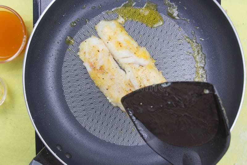Cooking dory fish Steak stock image. Image of ladle, fresh - 75360999