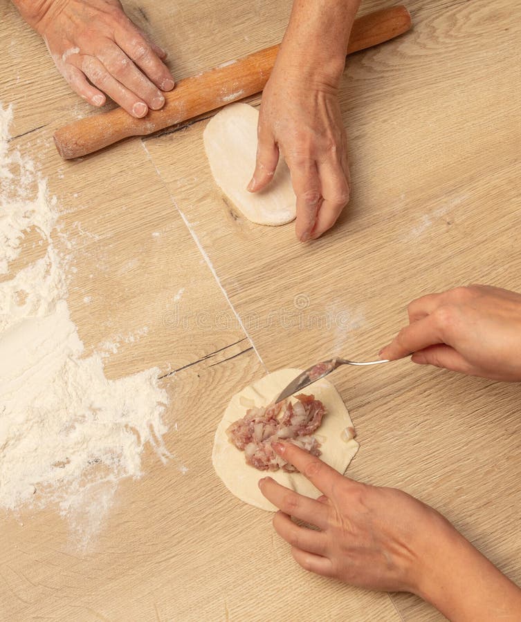 Cooking Dough with Meat on the Table. Stock Image - Image of asia, food ...