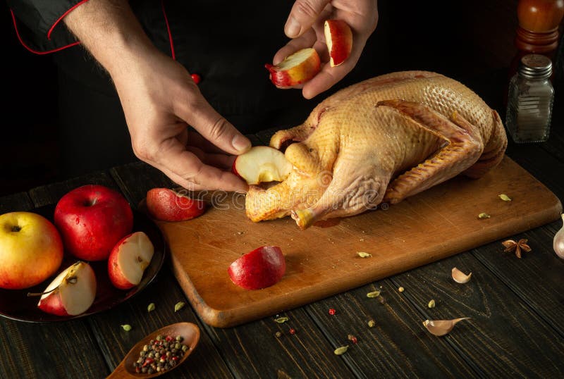 Cooking Duck with Apples and Spices for Lunch by the Cook Hands. Raw ...